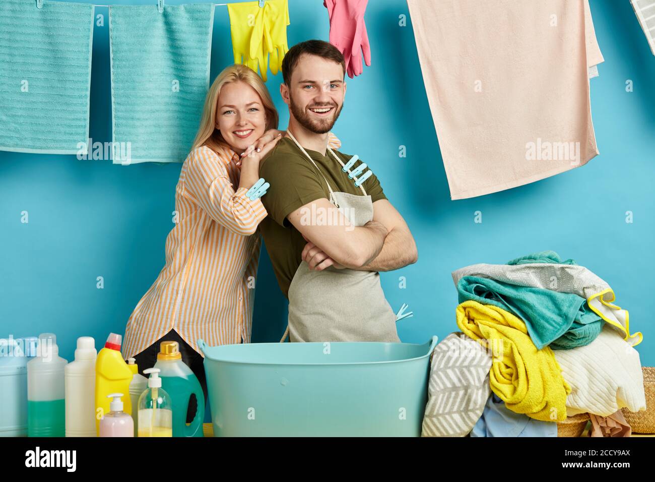 cheerful young couple are happy as they have finished housework. close ...