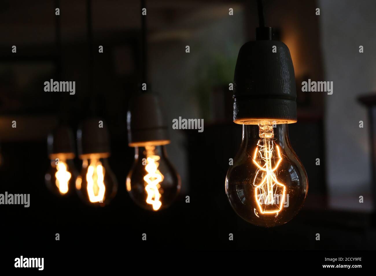 Closeup of vintage style light bulbs hanging from the ceiling Stock ...