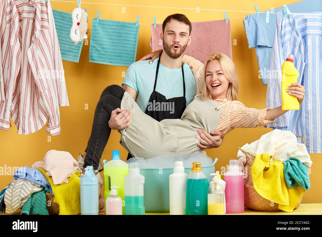 Funny Young Couple Having Fun While Doing Household Chores Feeling And