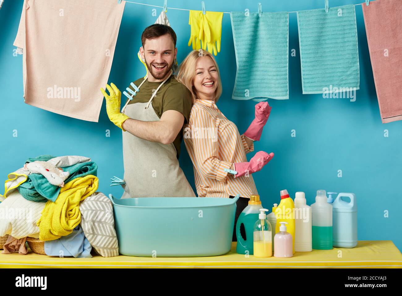 mad couple spending funny time in laundry room. lifestyle, close up ...