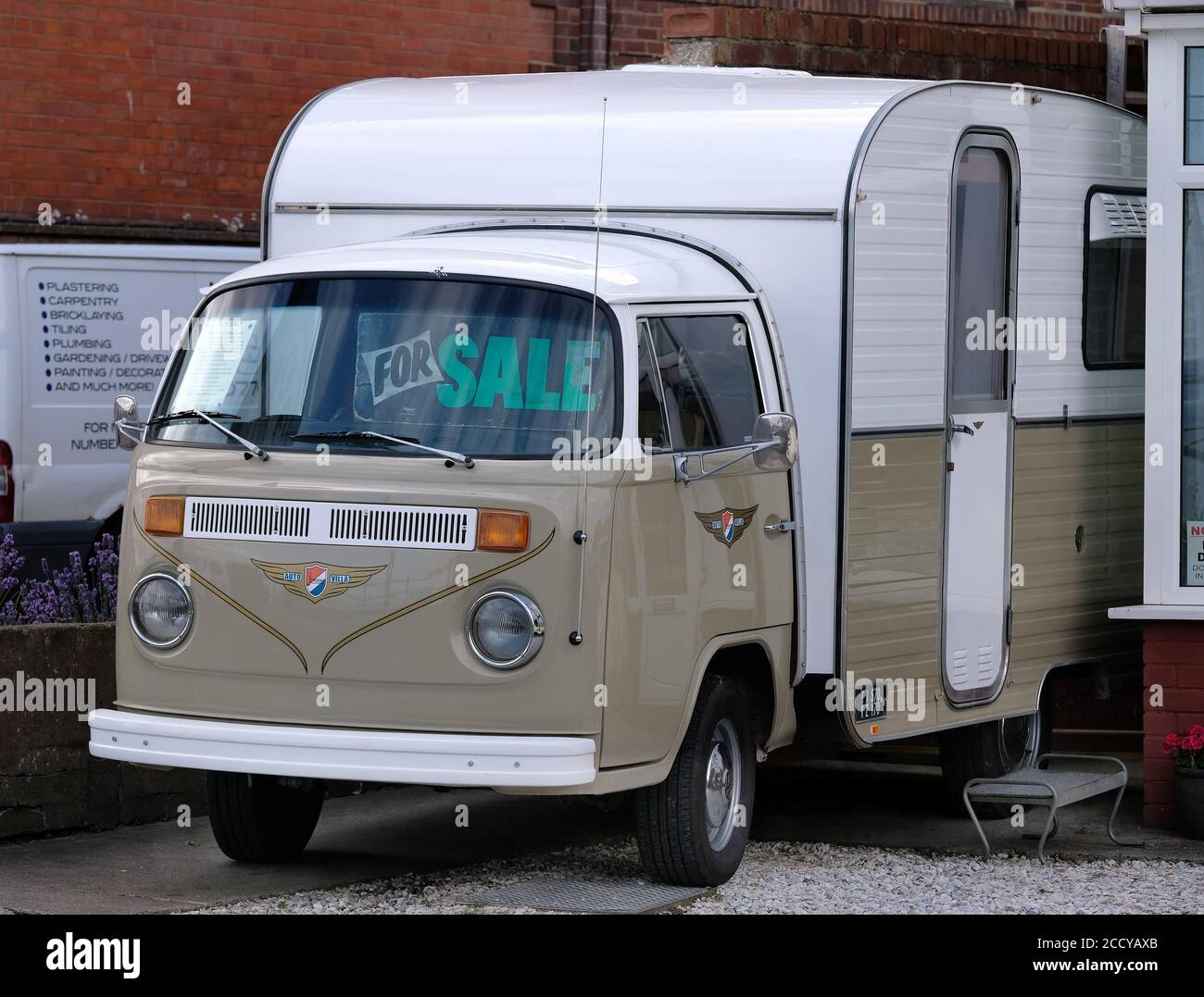 Volkswagon bus camping van in house drive Stock Photo - Alamy