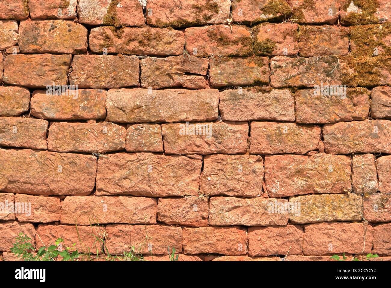 An Old brick wall, old texture of red stone blocks closeup Stock Photo ...