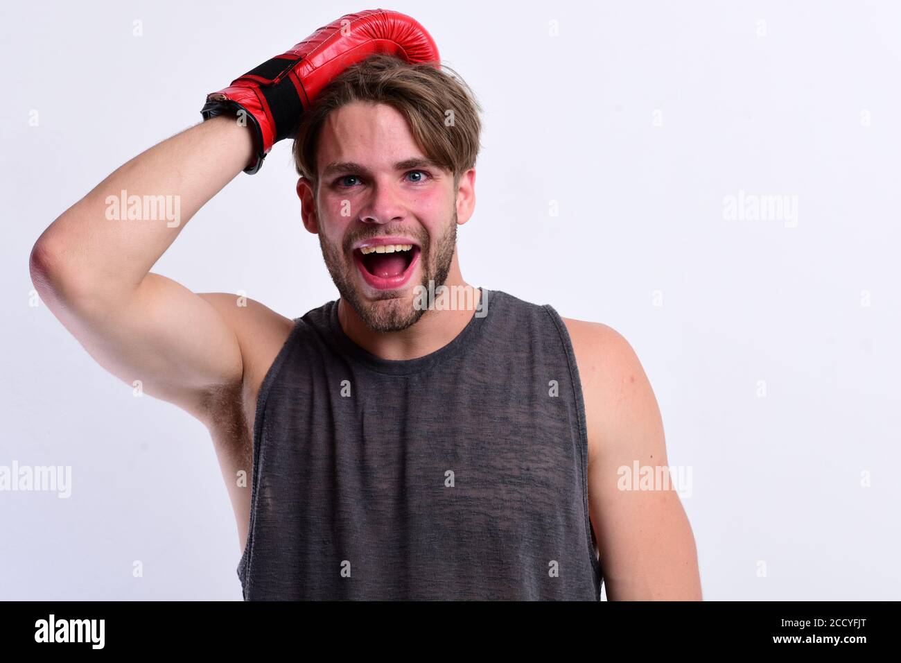 Boxer makes hits and punches as training. Man with bristle and happy ...