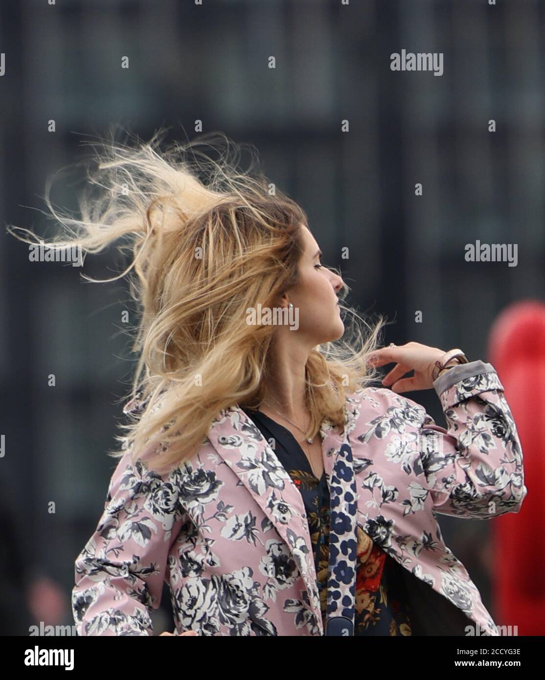 The wind catches a woman's hair in London, as Storm Francis hit the UK ...