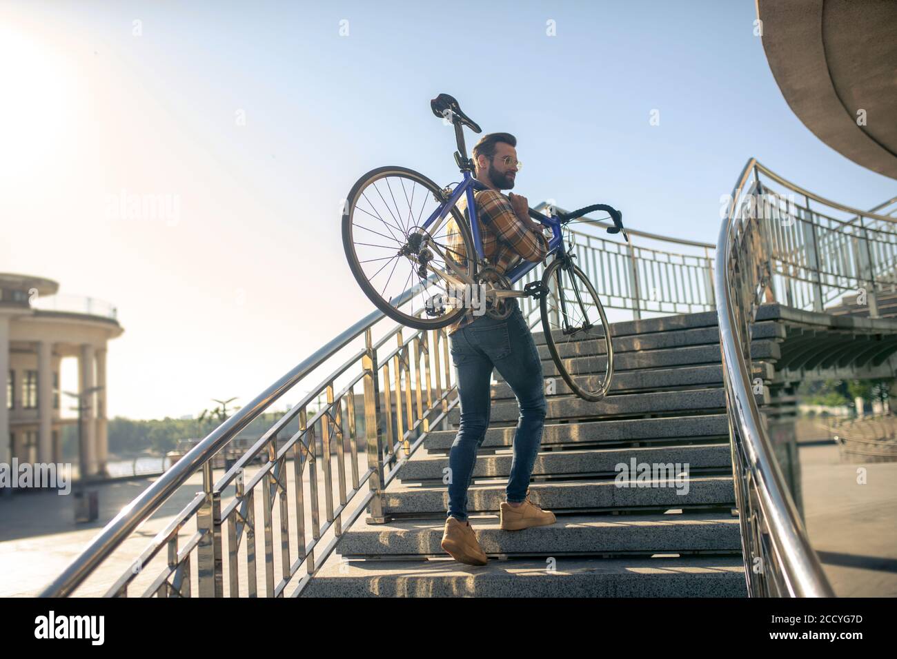 Man climbing stairs hi-res stock photography and images - Alamy