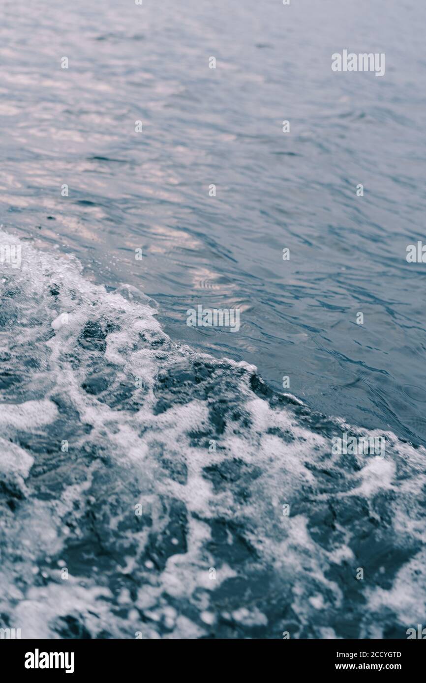 Splash of sea water from the boat Stock Photo - Alamy