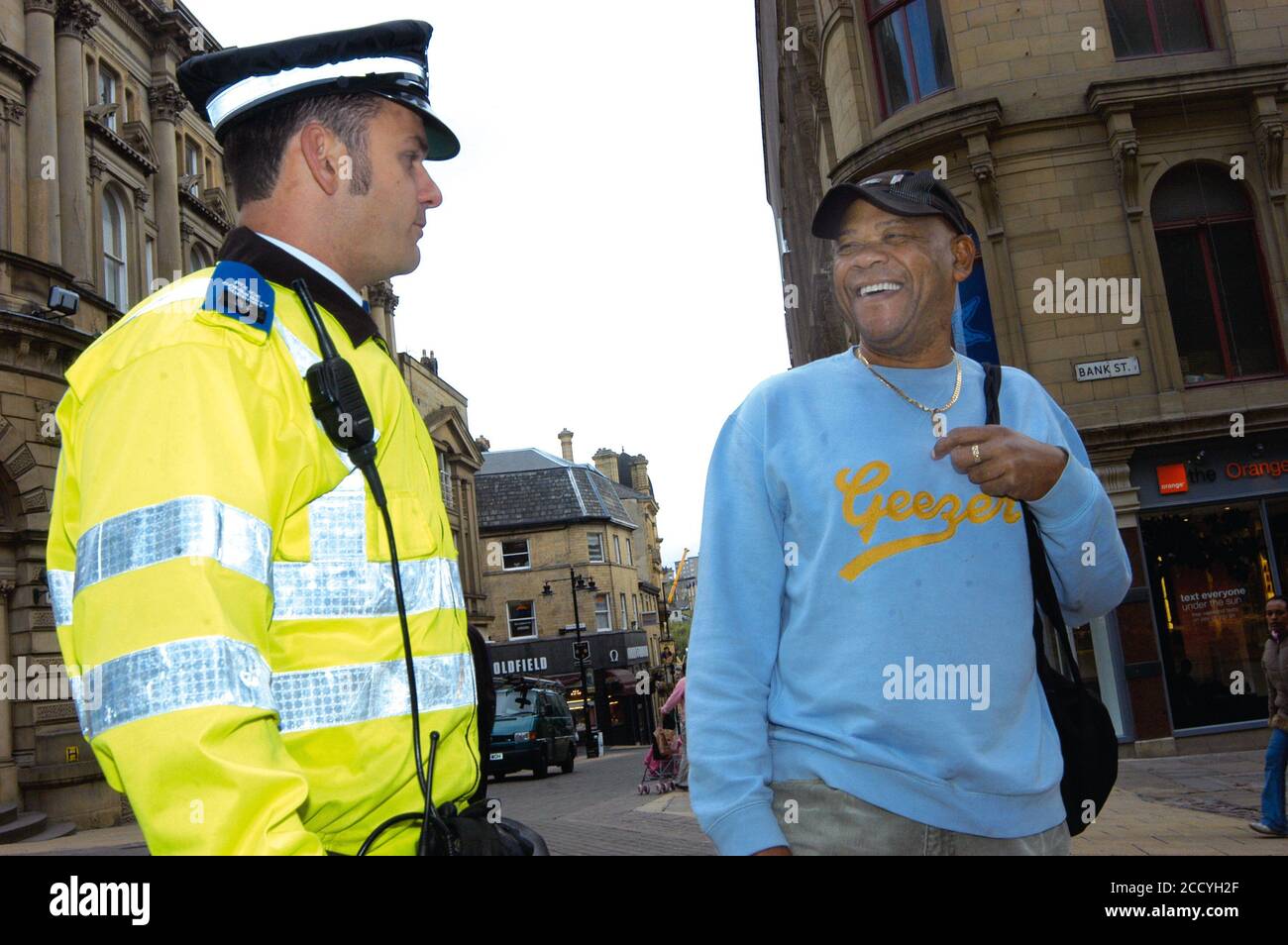 Police Community Support Officer chats to members of public in the ...
