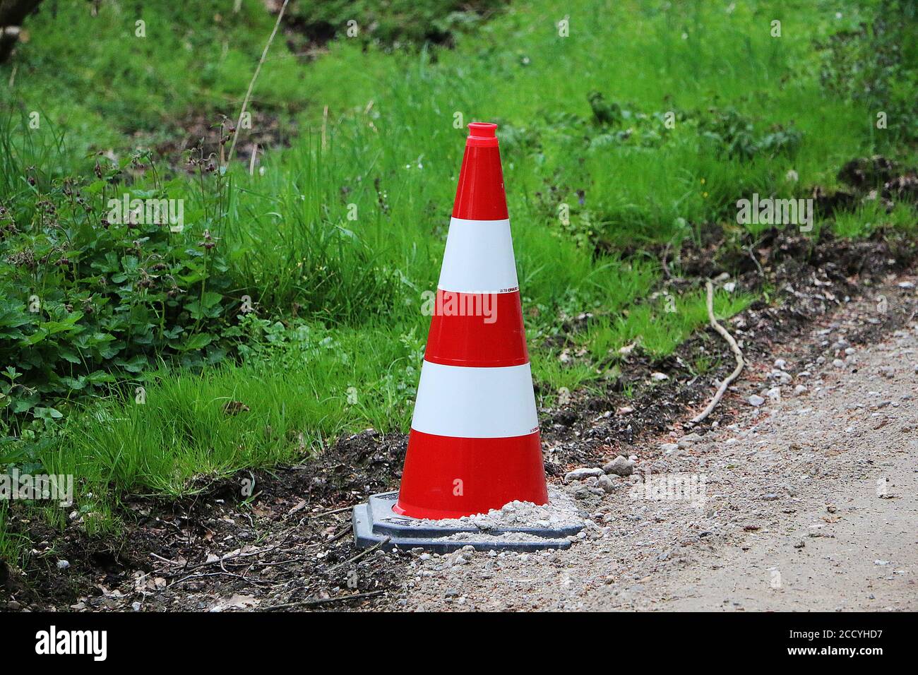 Close up shot of a cone signal on the ground Stock Photo - Alamy