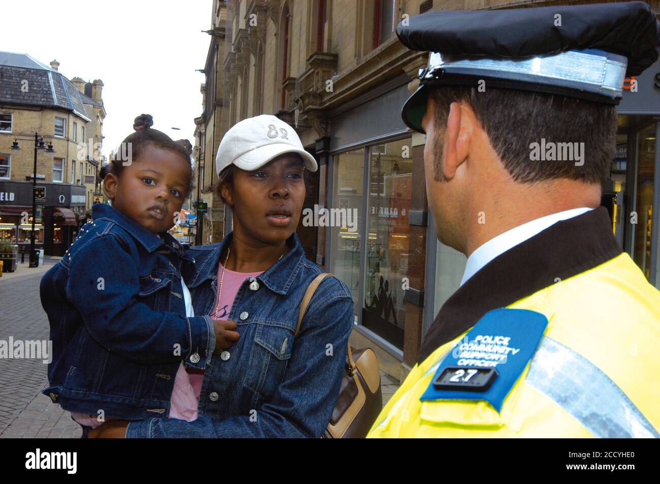 Police Community Support Officer chats to members of public in the ...