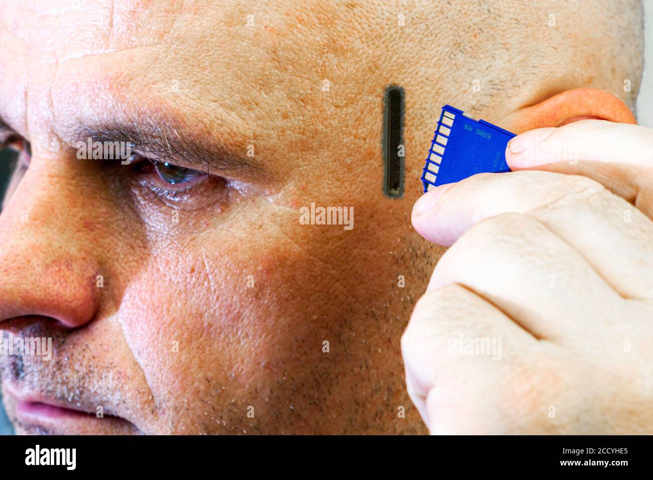 concept computerization chipization computer addiction a man inserts a ...