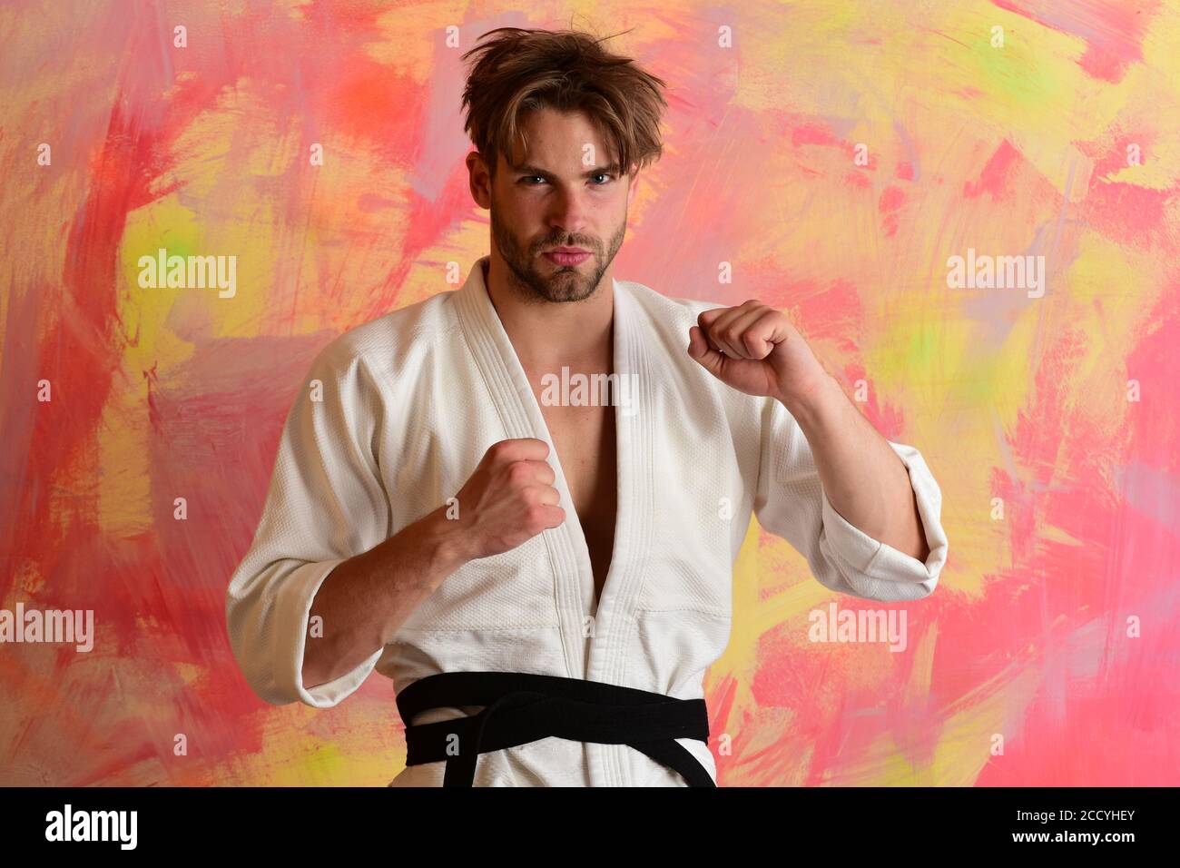 Japanese karate and sports concept. Man with serious face and bristle ...