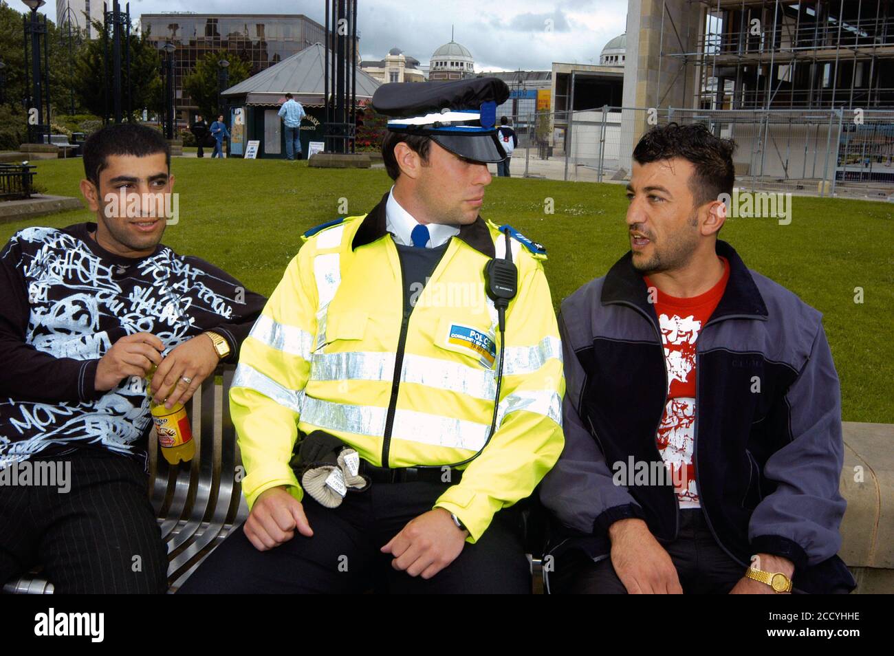 Police Community Support Officer chats to members of public in the ...