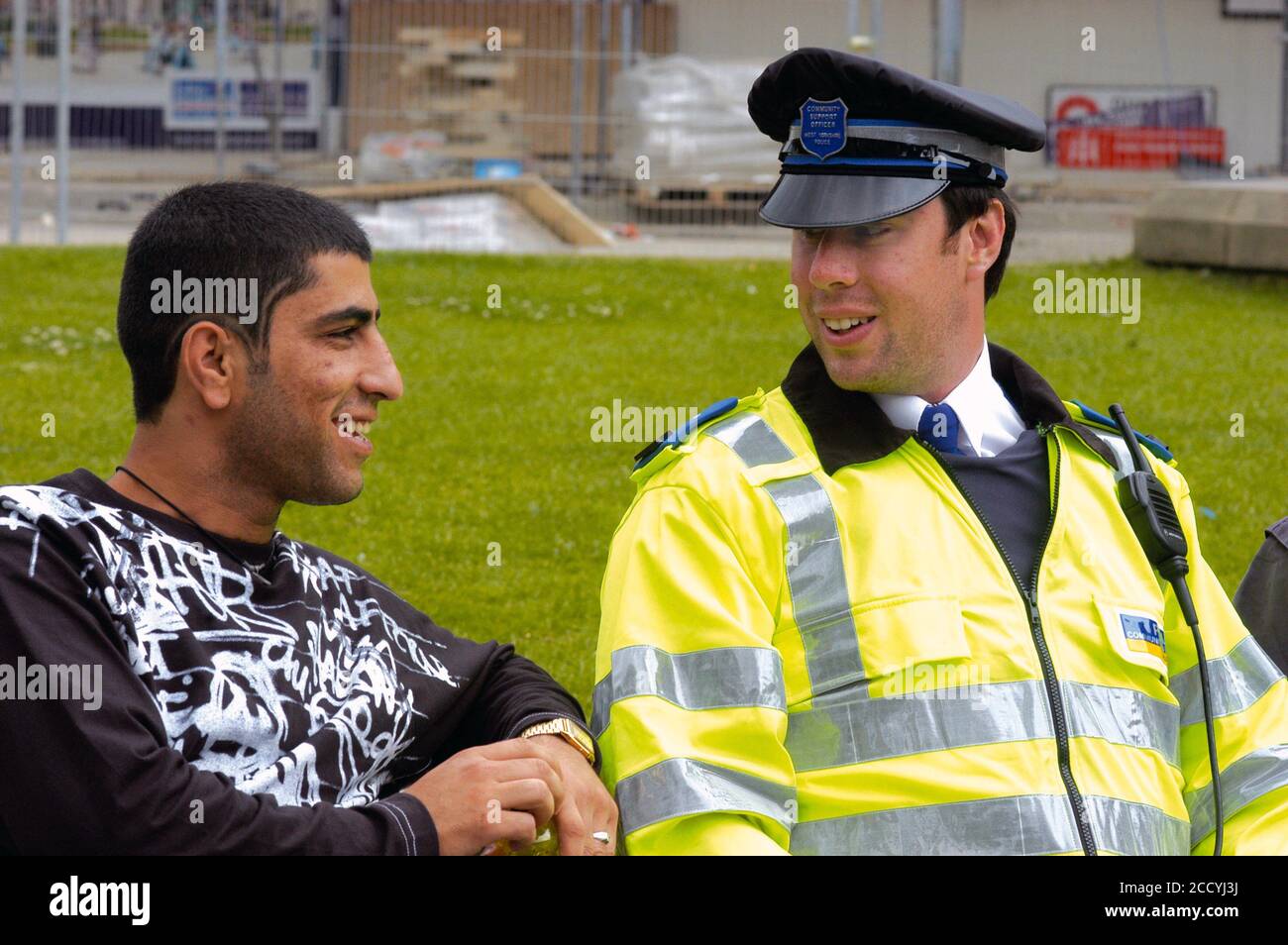Police Community Support Officer chats to members of public in the ...