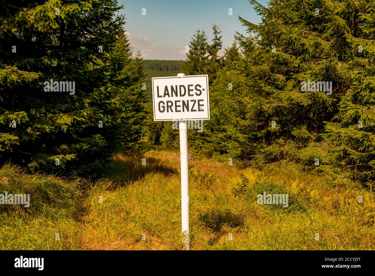 A sign National border in German as text Stock Photo - Alamy