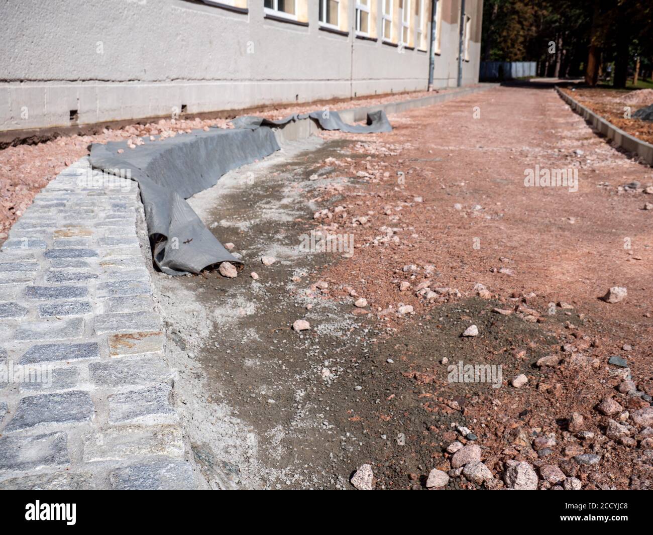 new natural stone wall road construction landscaping Stock Photo - Alamy