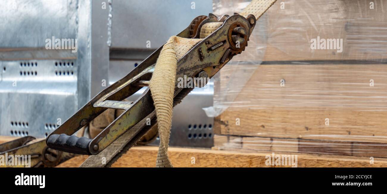 Truck strap for securing cargo Stock Photo - Alamy