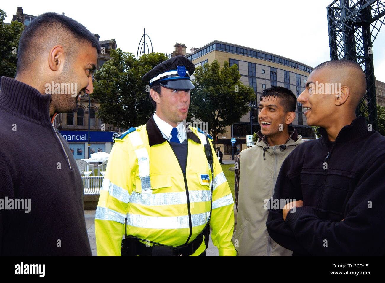 Police Community Support Officer chats to members of public in the ...