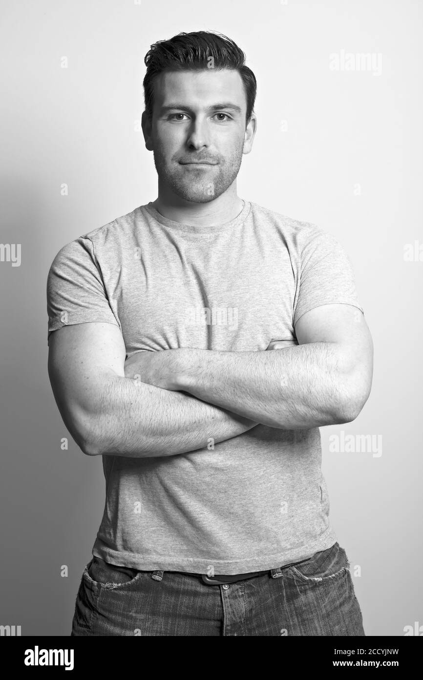 Casual black and white male portrait with crossed arms Stock Photo - Alamy