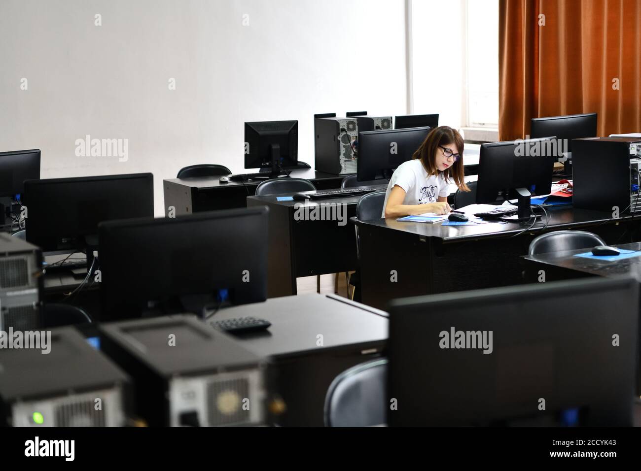 Only one female student in computers and technology classroom working ...