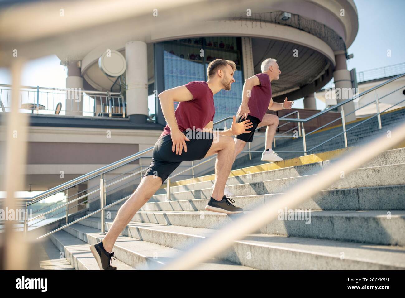 Black man running up stairs hi-res stock photography and images - Alamy