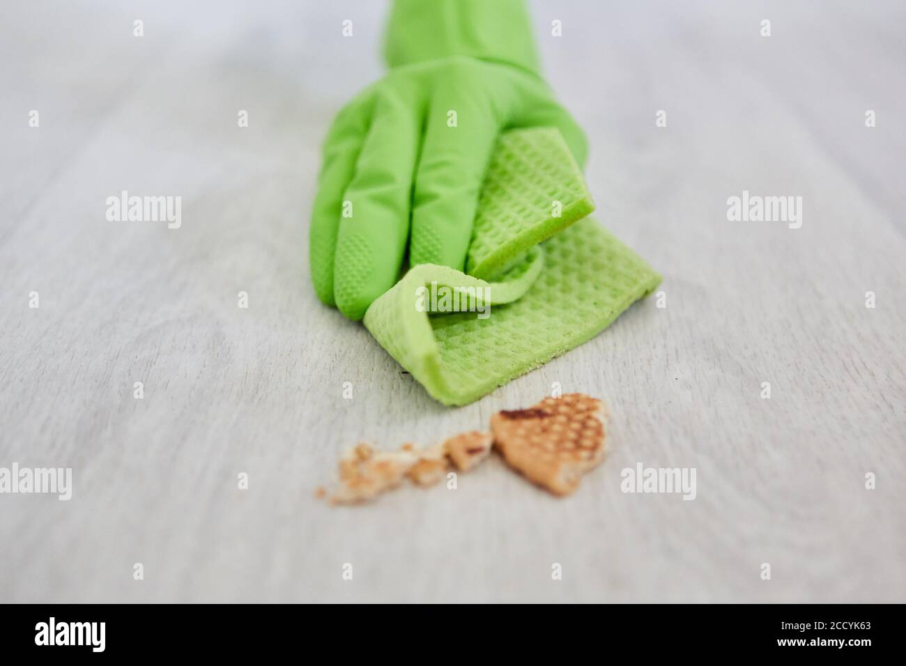 Hands with rag wipe crumbs from table in kitchen during cleaning Stock ...