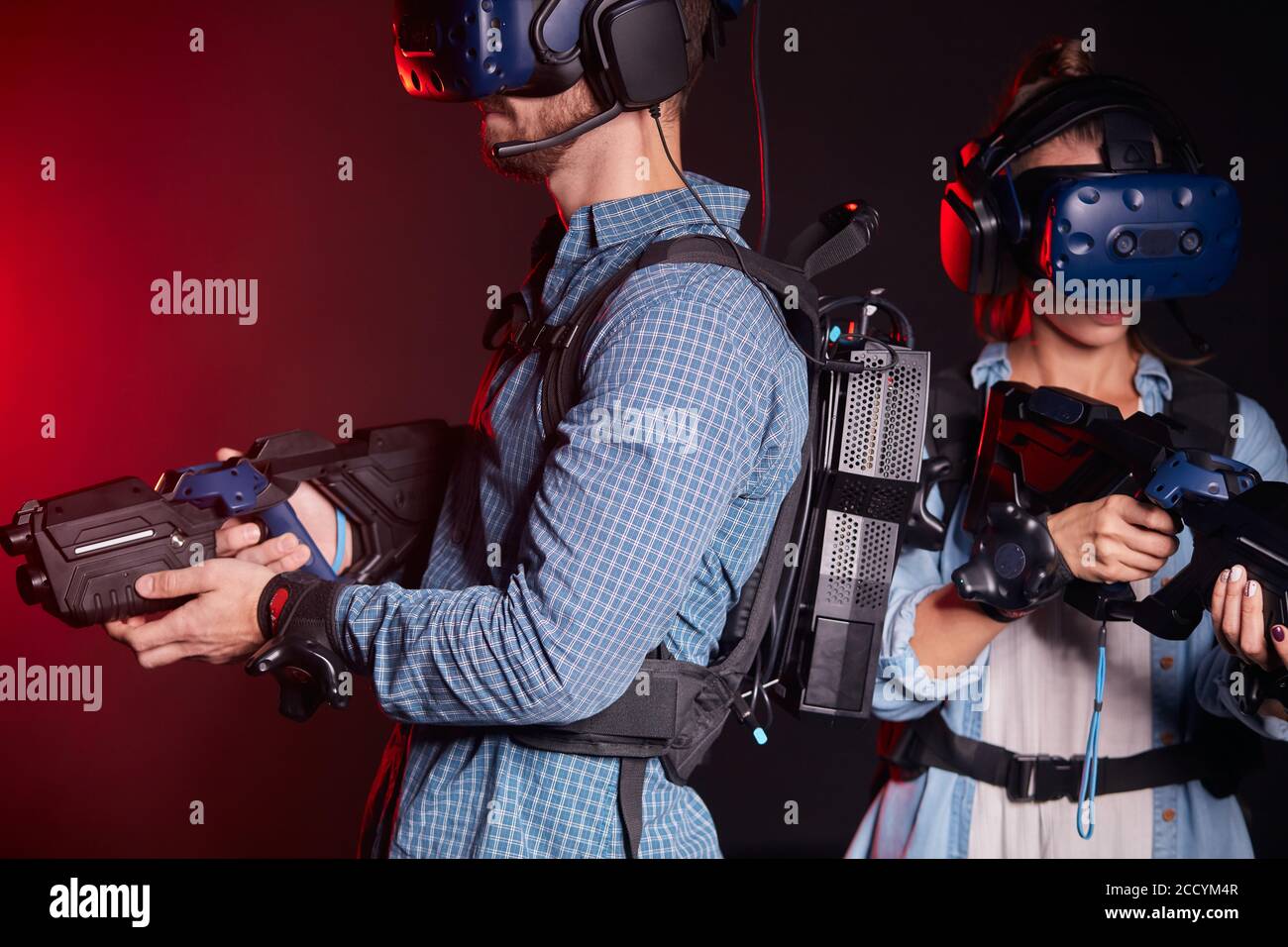 Lovely couple playing vr game as team, fighting. Wearing casial clothes ...