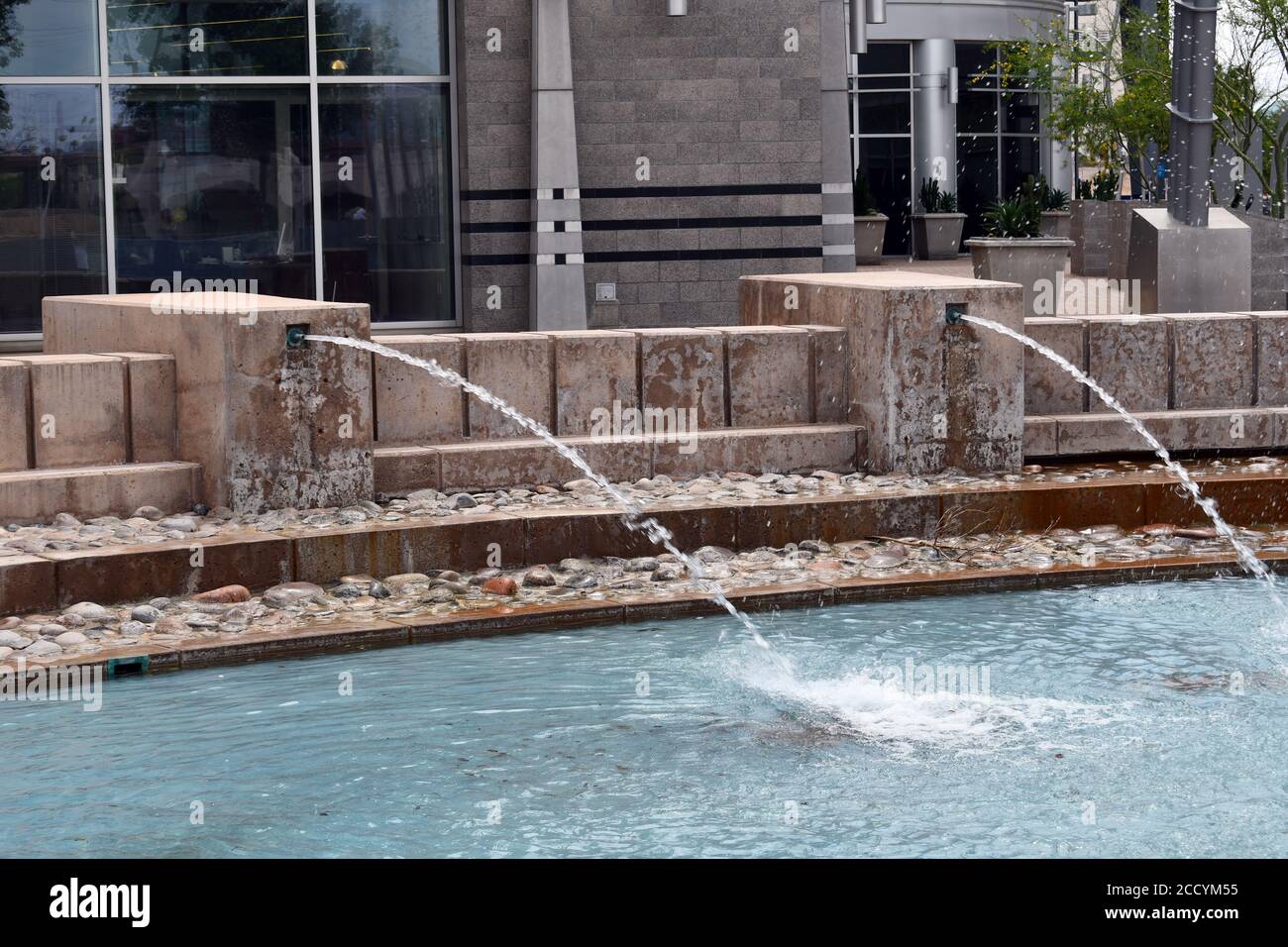 Closeup shot of a water fountain in front of a modern building Stock ...