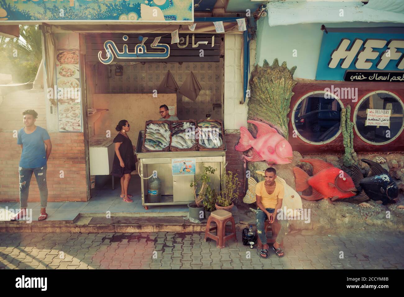 Egypt, Hurghada. egyptian everyday street life at sidewalk buildings ...