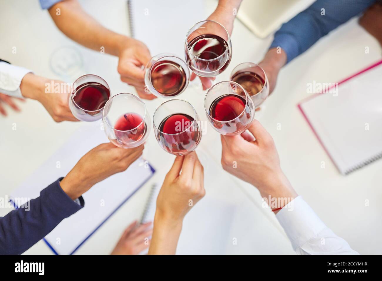 Group of business people drinking red wine in office as alcohol concept ...