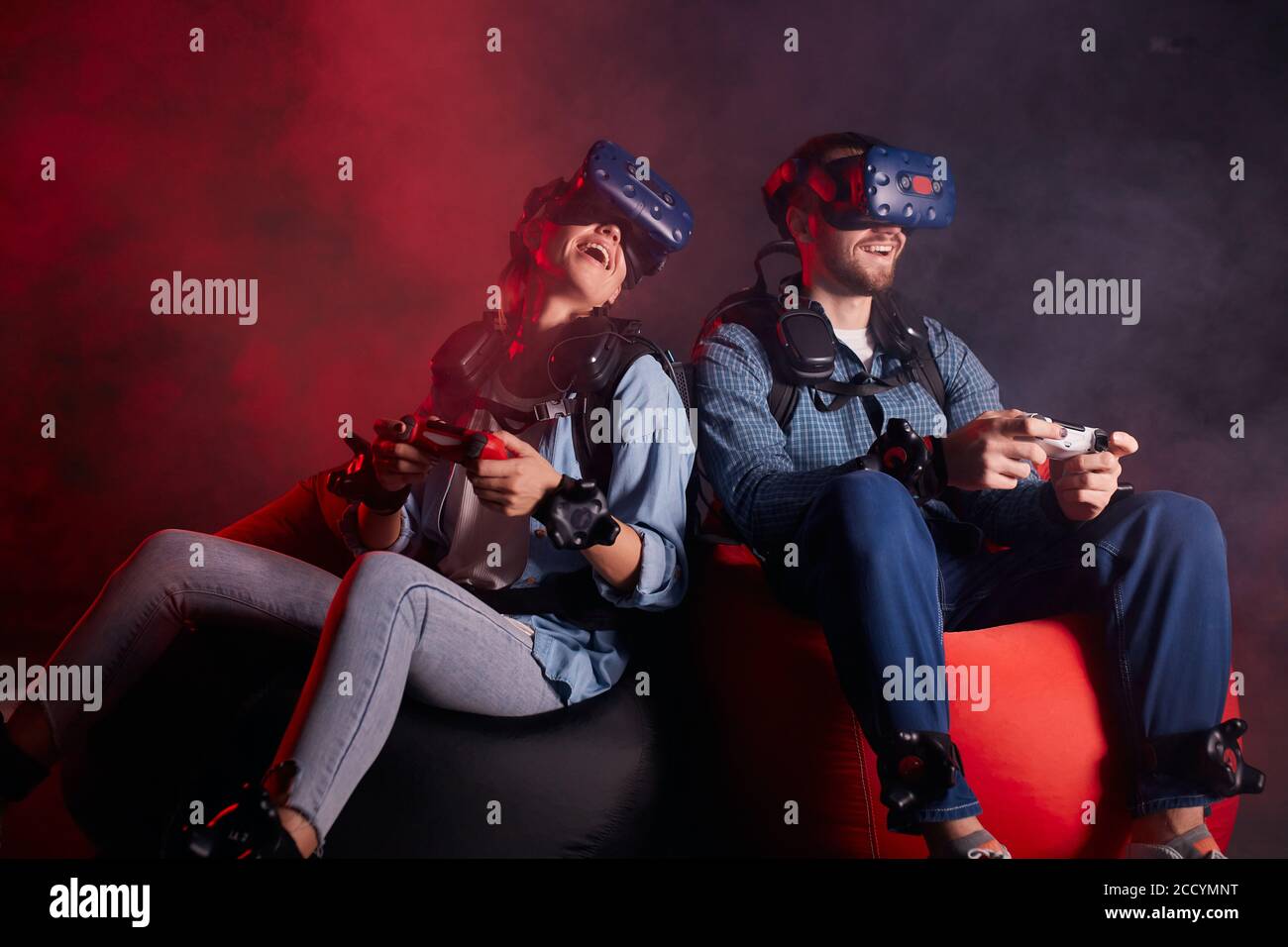 Cheerful and positive people having fun with new trends technology ...