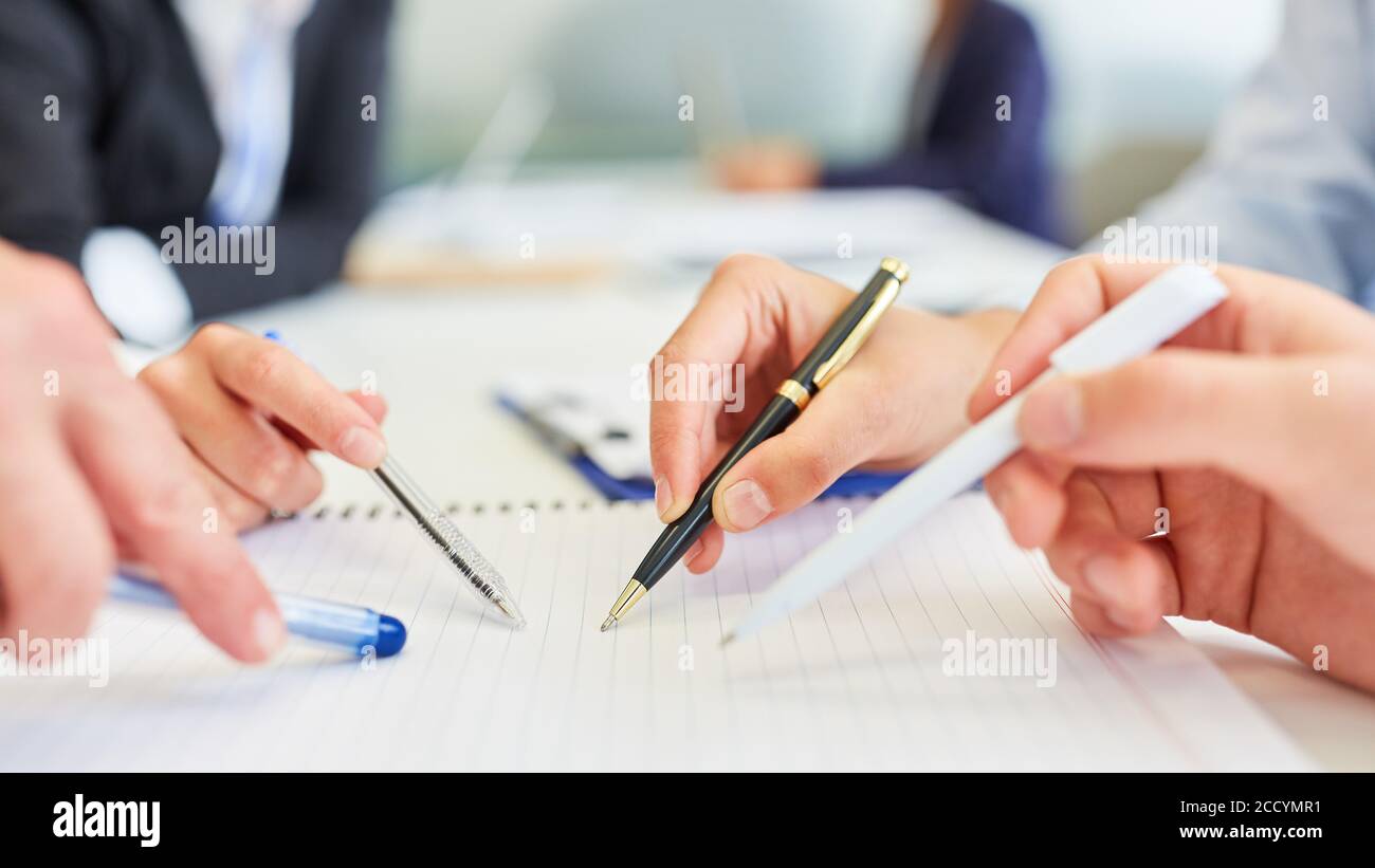 Hands of business people with pen when scheduling a meeting Stock Photo ...