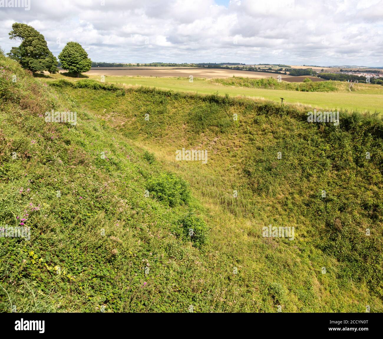Deep defensive ditch and rampart at Old Sarum castle, Salisbury ...