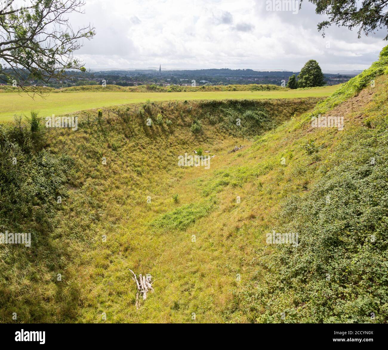 Deep defensive ditch and rampart at Old Sarum castle, Salisbury ...