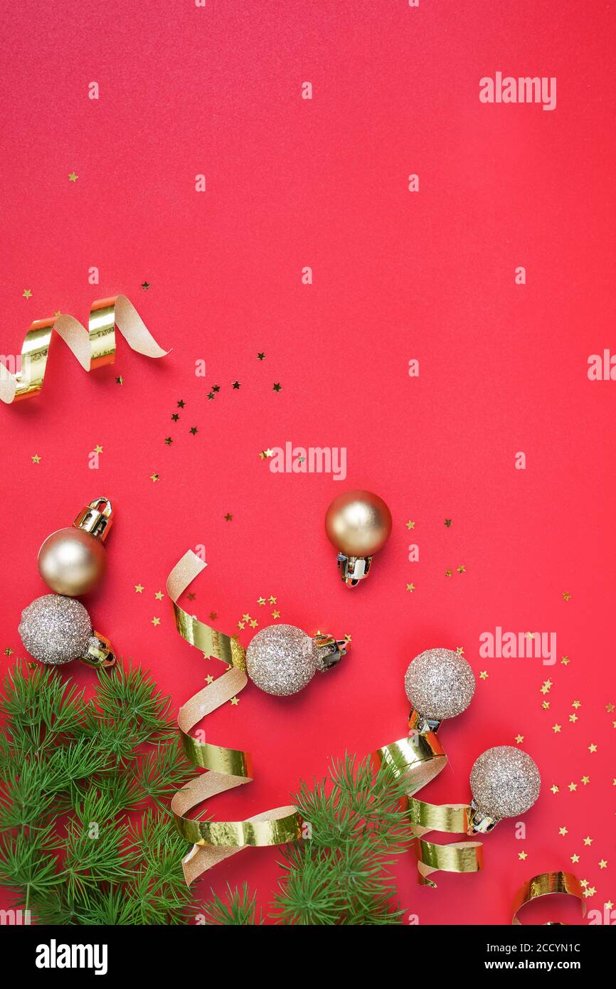 Festive Christmas decor of golden color on red background with copy ...