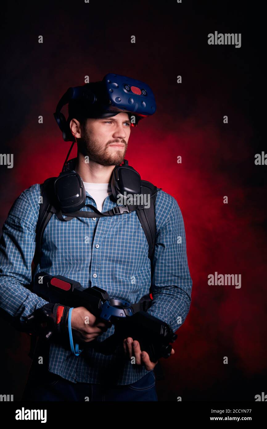 Prepared gamer man look side, looking for enemy. Virtual reality ...