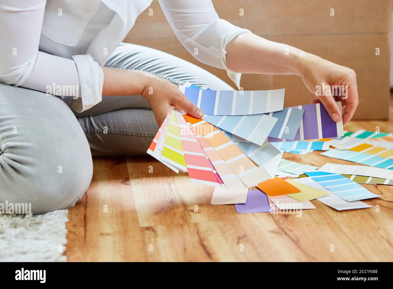 Woman as a DIY handyman with color palette when choosing colors for ...