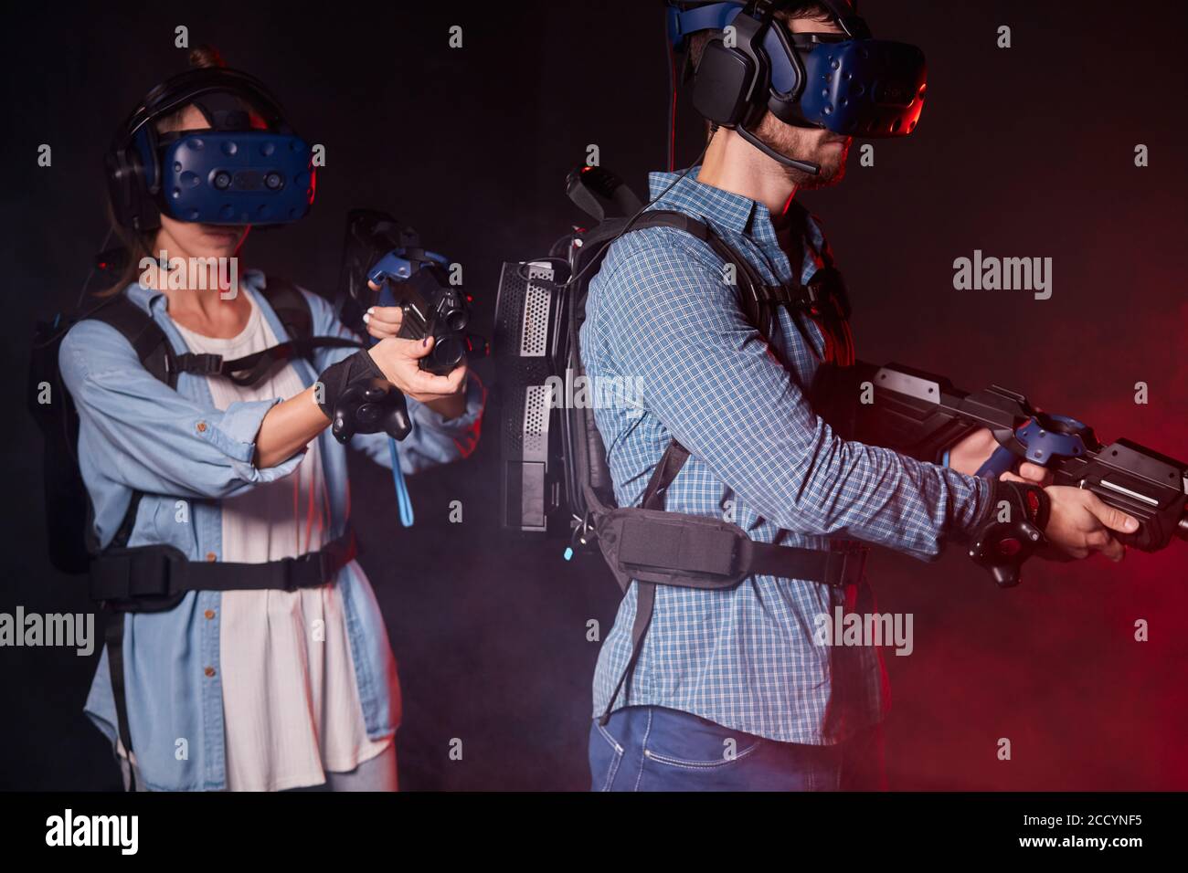 Lovely couple playing vr game as team, fighting. Wearing casial clothes ...