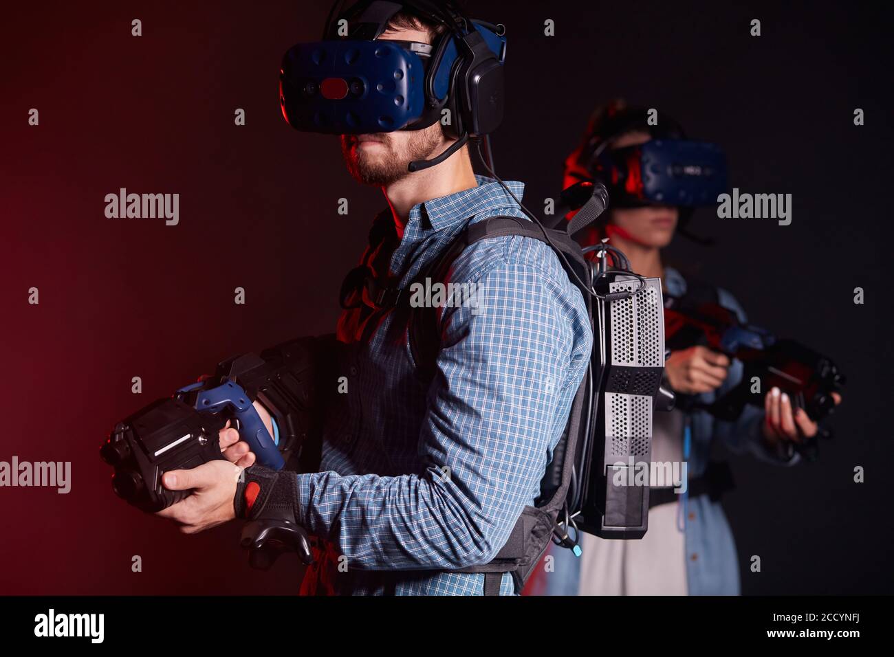 Lovely couple playing vr game as team, fighting. Wearing casial clothes ...