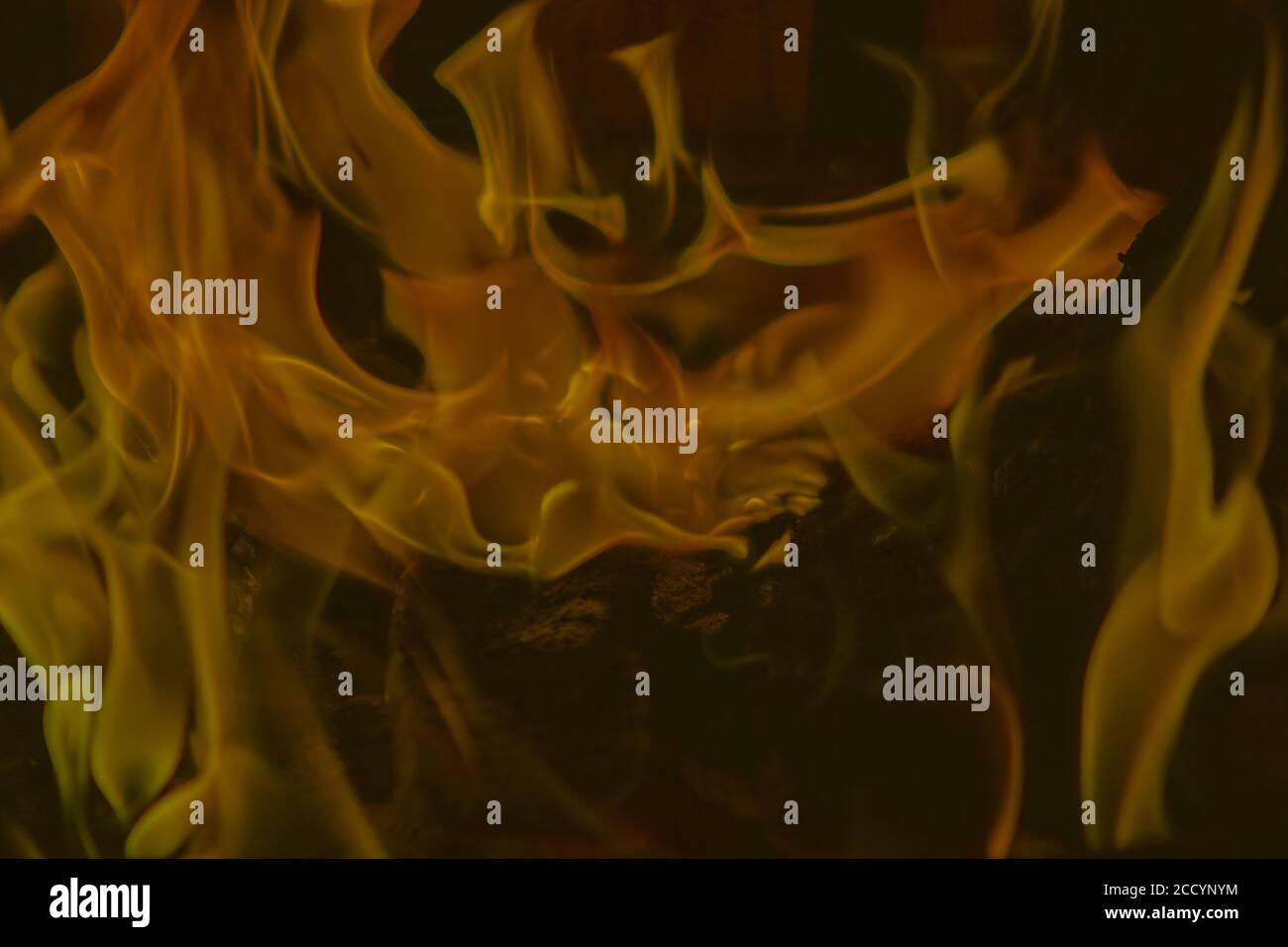 Closeup shot of blazing fire flame isolated on black background Stock ...