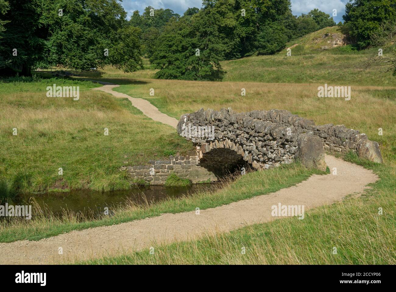 One of the rustic stone bridges over the River Skell in the Studley ...