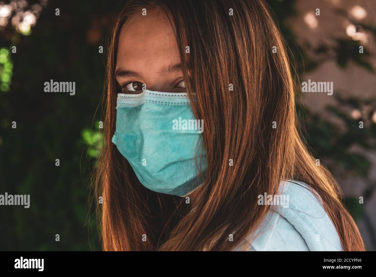 attractive young woman outside wearing surgical face mask protection ...