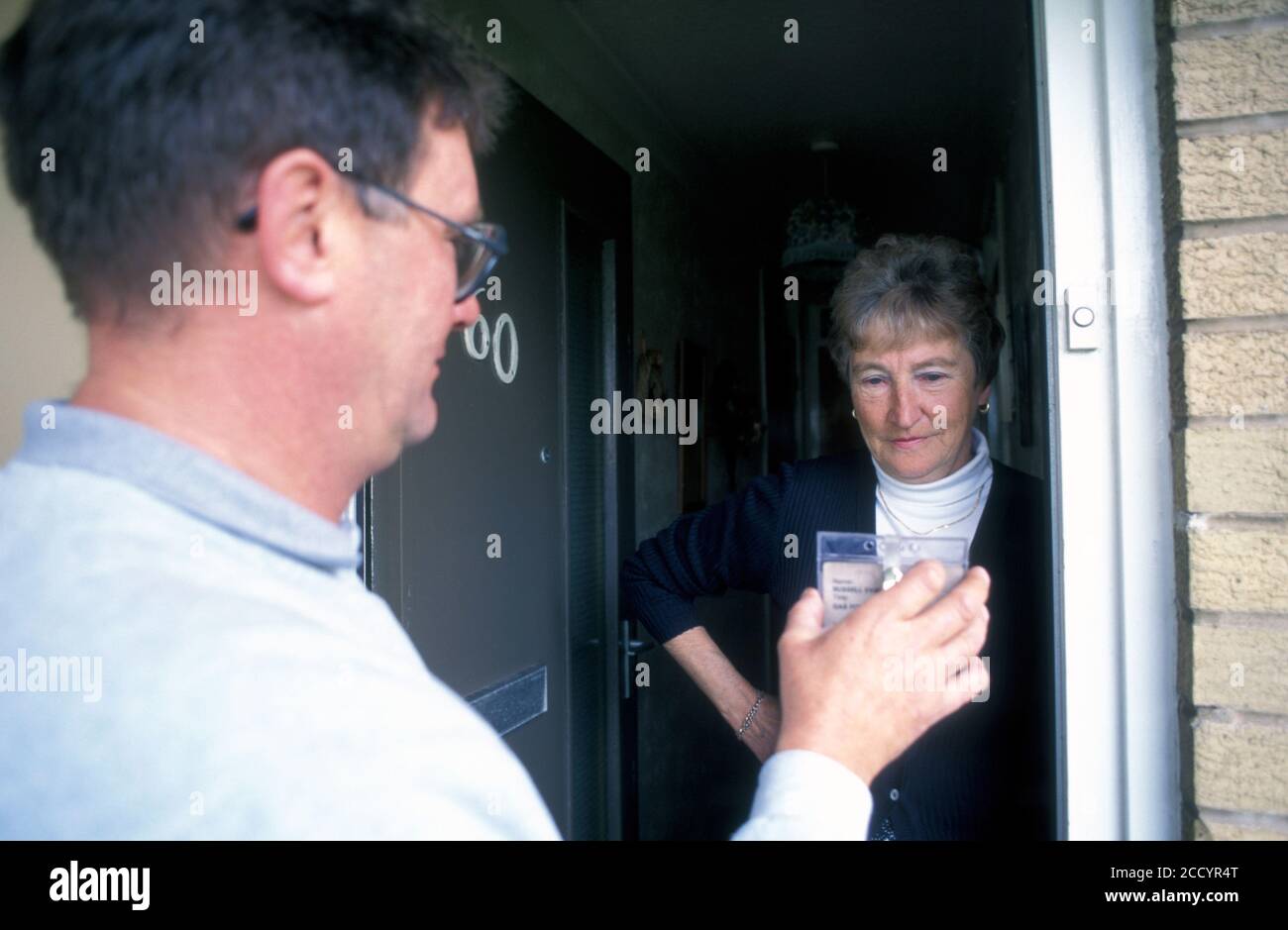 Showing identification at front door hi-res stock photography and ...