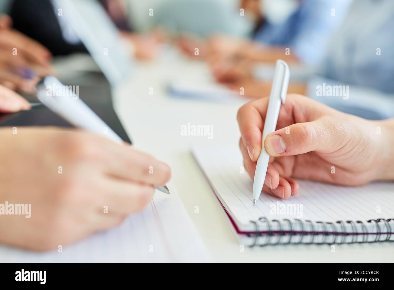 Hands of business people took notes in a business meeting Stock Photo ...