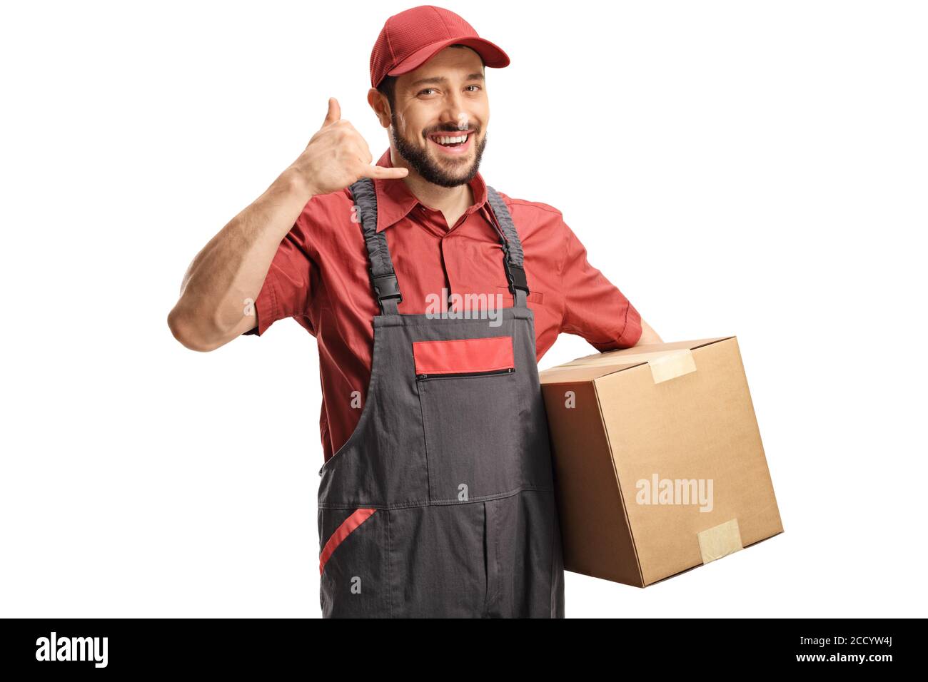 Worker holding cardboard boxes and gesturing a phone call with hand ...