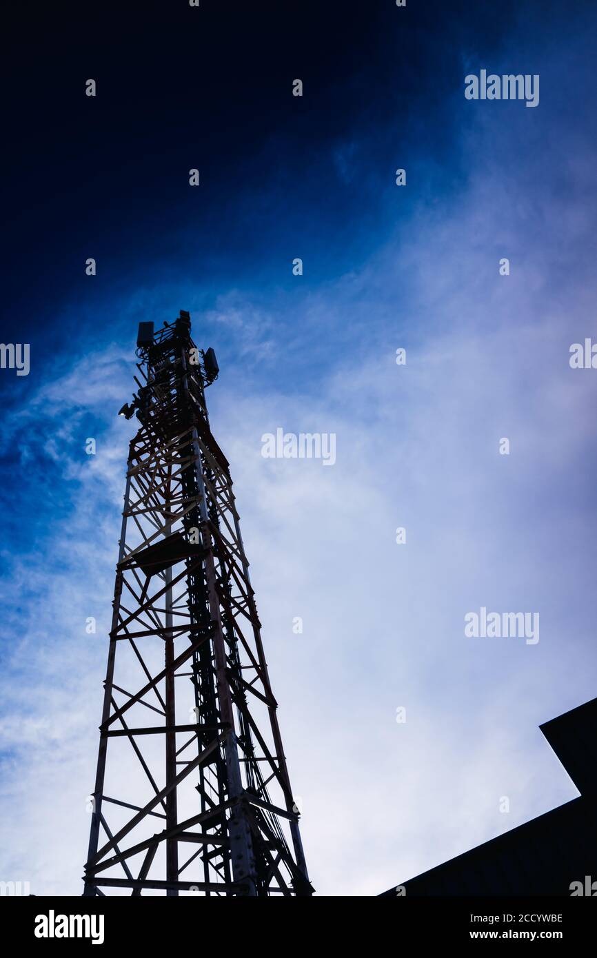 A tall modern communications tower provides telecommunications service ...