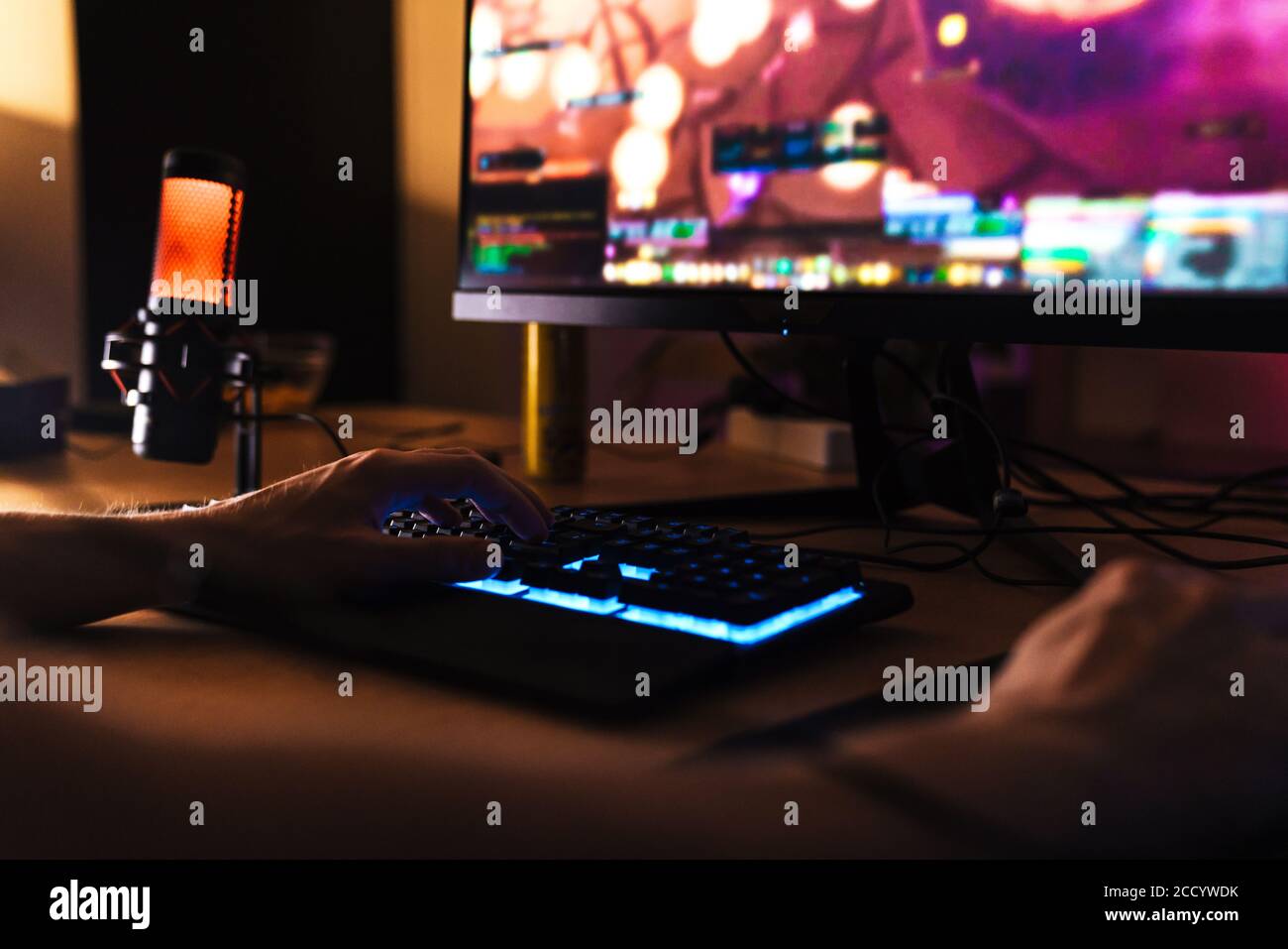 Cropped image of caucasian man playing video game on computer with ...