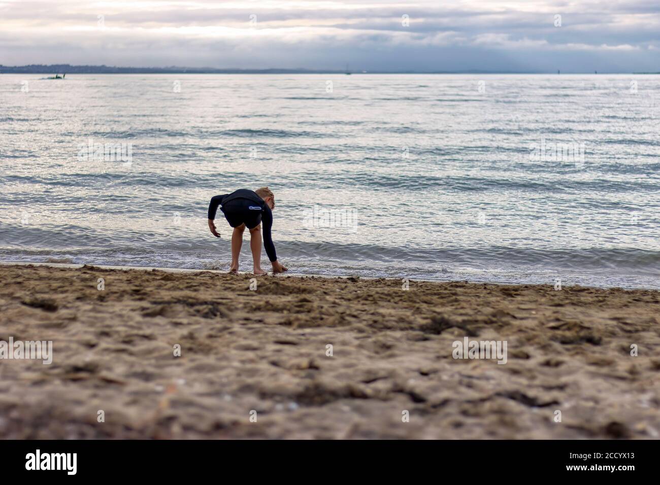 Boy playing on the beach hi-res stock photography and images - Alamy