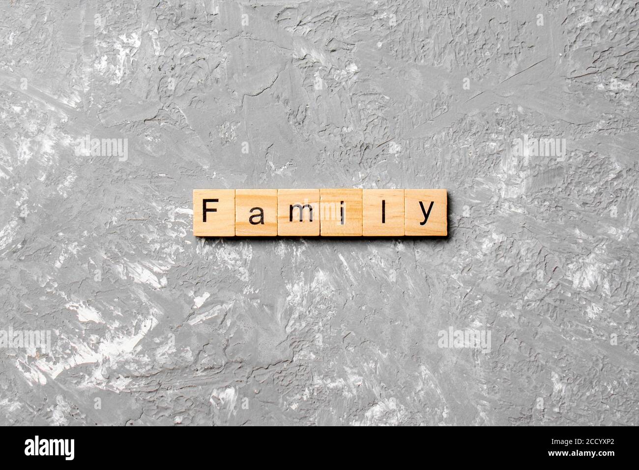 family word written on wood block. family text on table, concept Stock ...