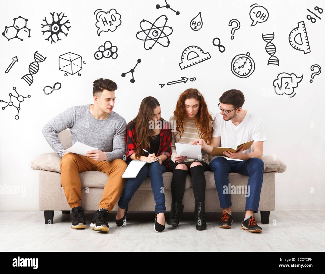 Concentrated students making scientific project together, studio shot ...