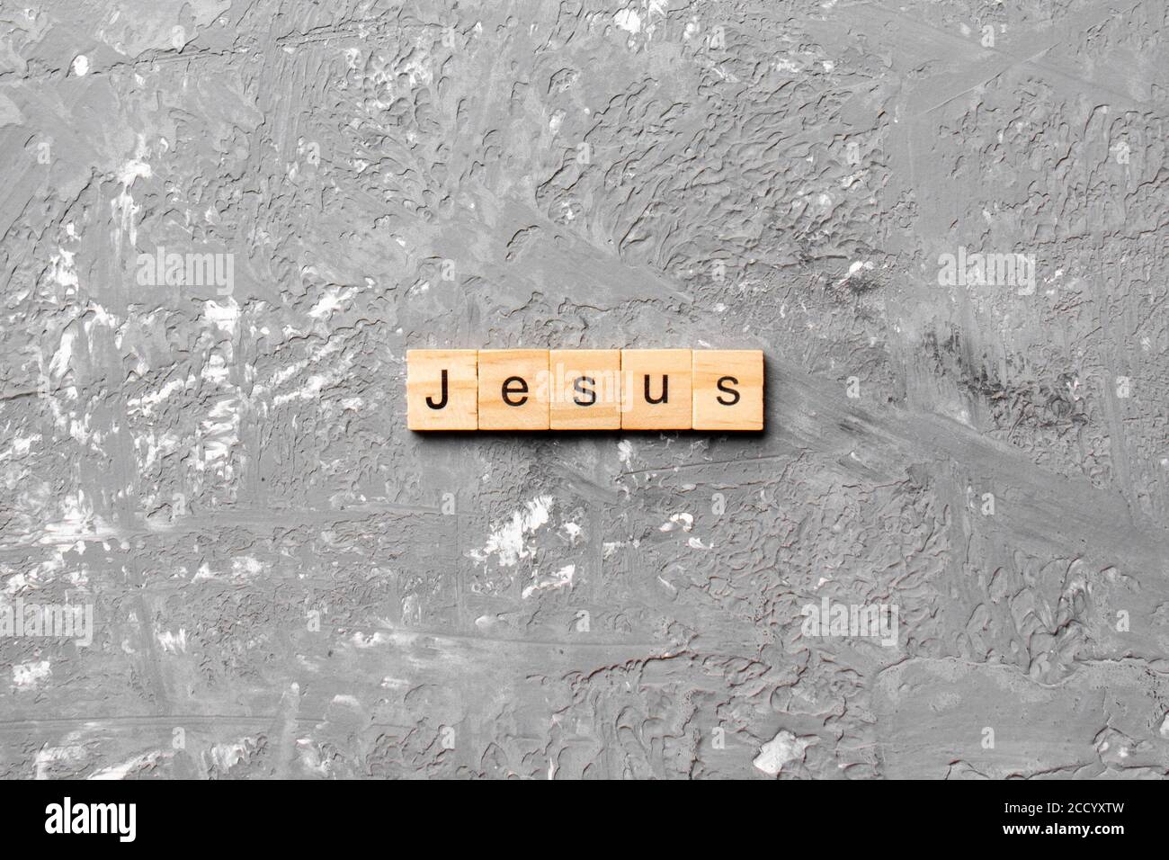 Jesus word written on wood block. Jesus text on table, concept Stock ...